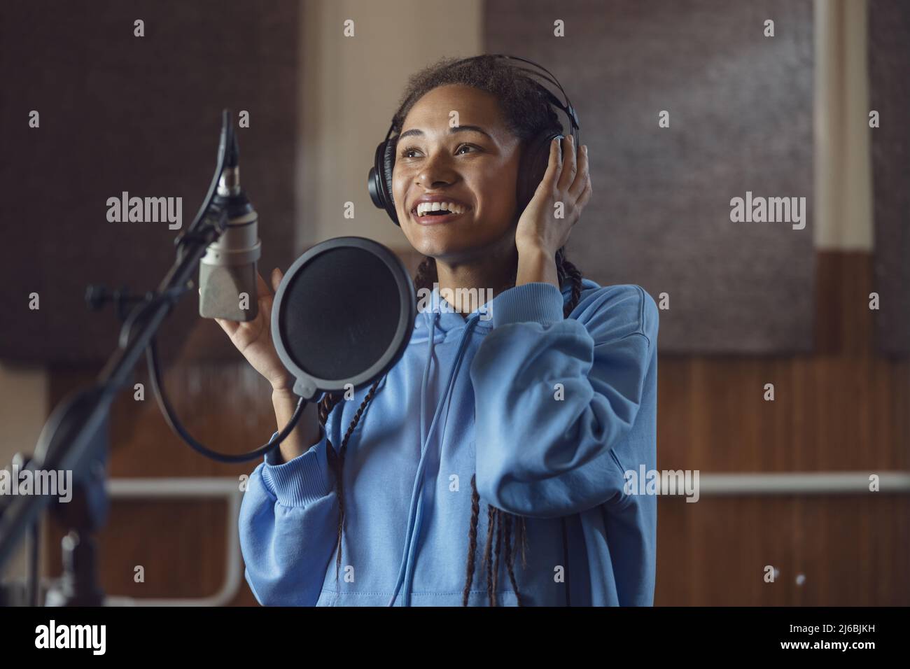Female singer records new song. Emotional actress voices text ...
