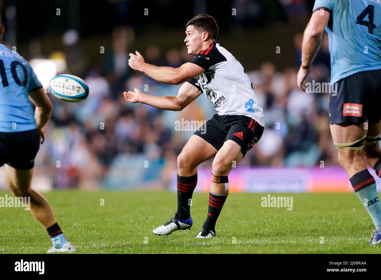 SYDNEY, AUSTRALIA - APRIL 30: Simon Hickey of Crusaders passes the ball ...