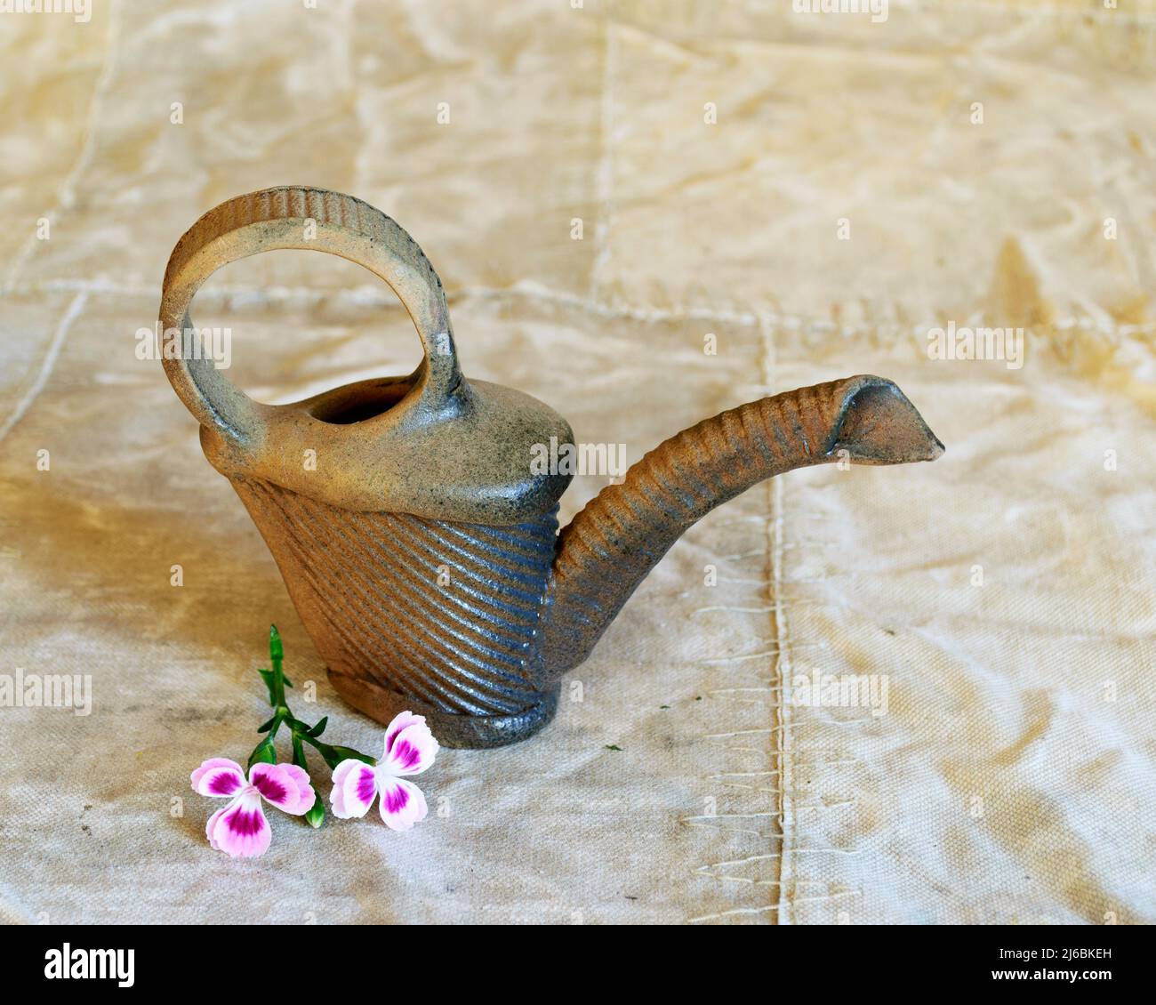 decorative clay mug, crumpled fabric background, handmade, still life ...