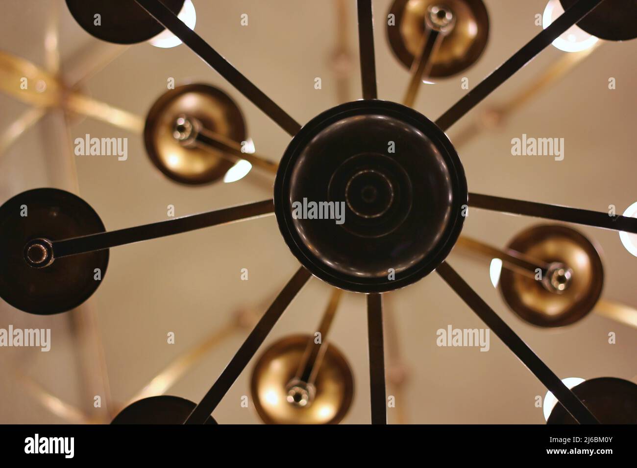 Bottom view of a traditional colonial chandelier illuminating the ...