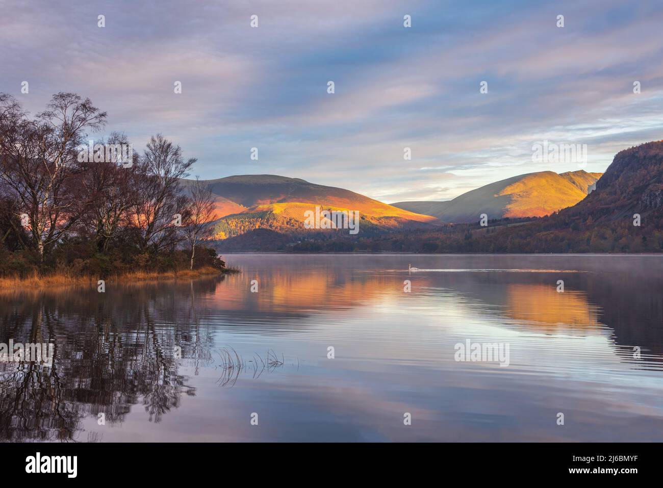 Epic Autumn sunrise landscape image looking from Manesty Park in Lake ...