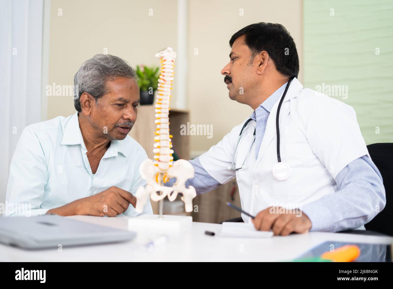 Doctor busy checking sick senior elderly patient at hospital during ...