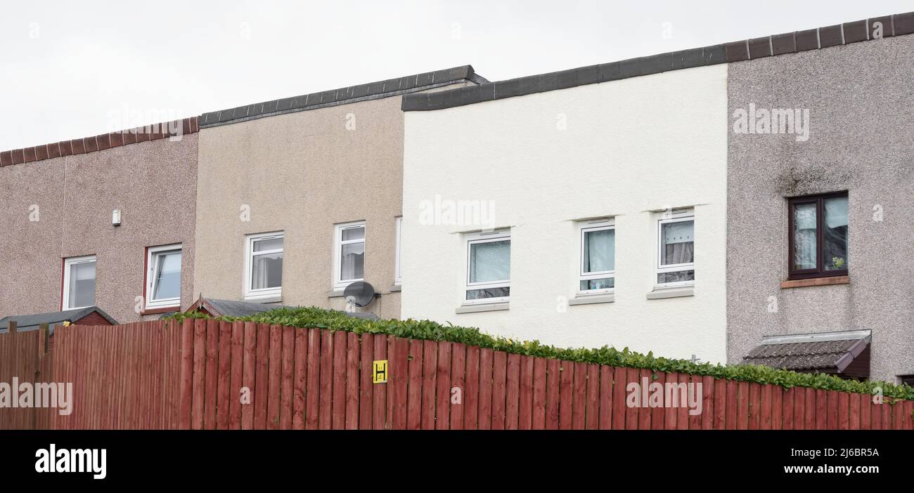 Derelict council house in poor housing estate slum with many social ...