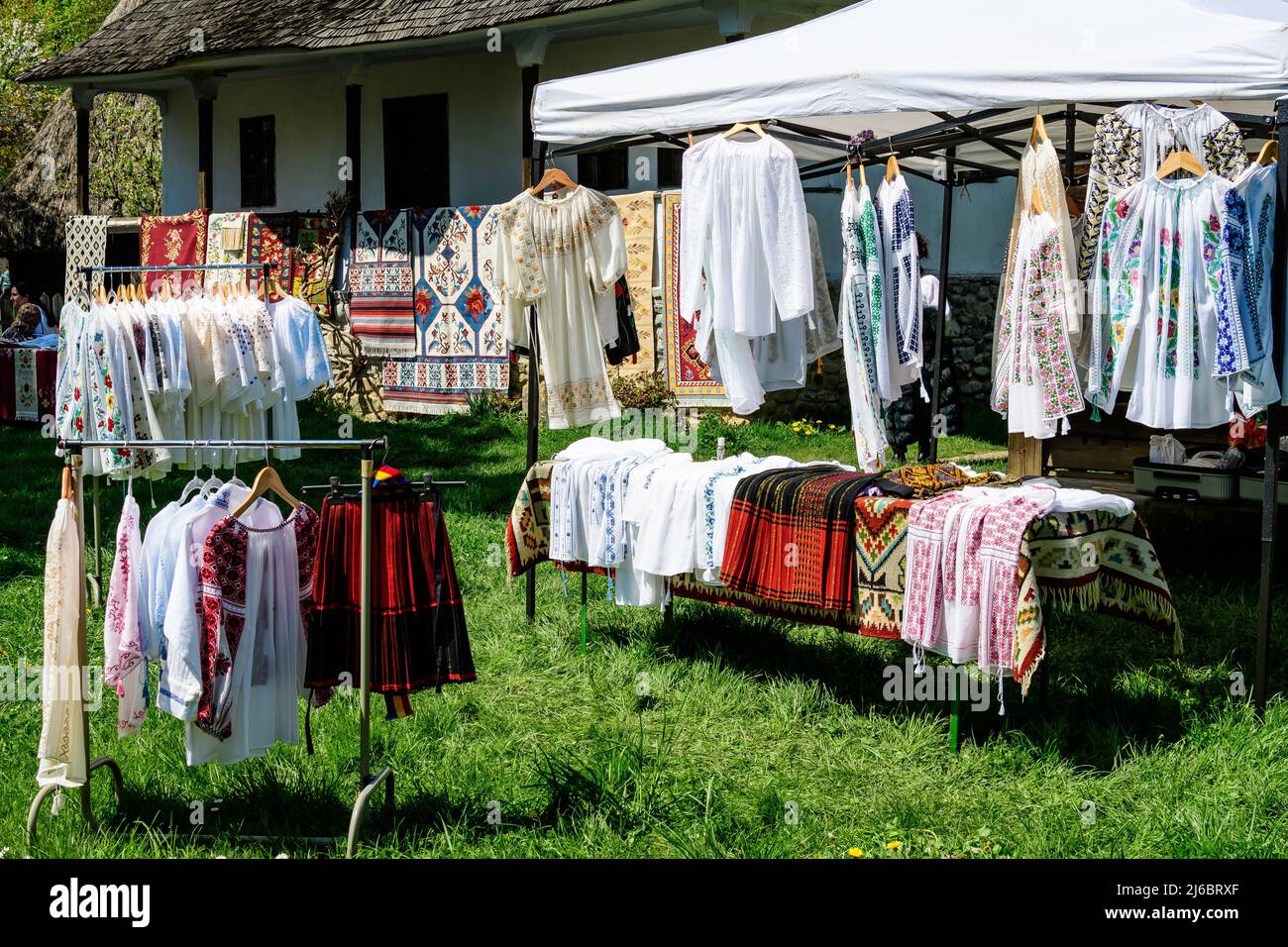 Traditional Romanian hand made clothes displayed for sale at a hand ...