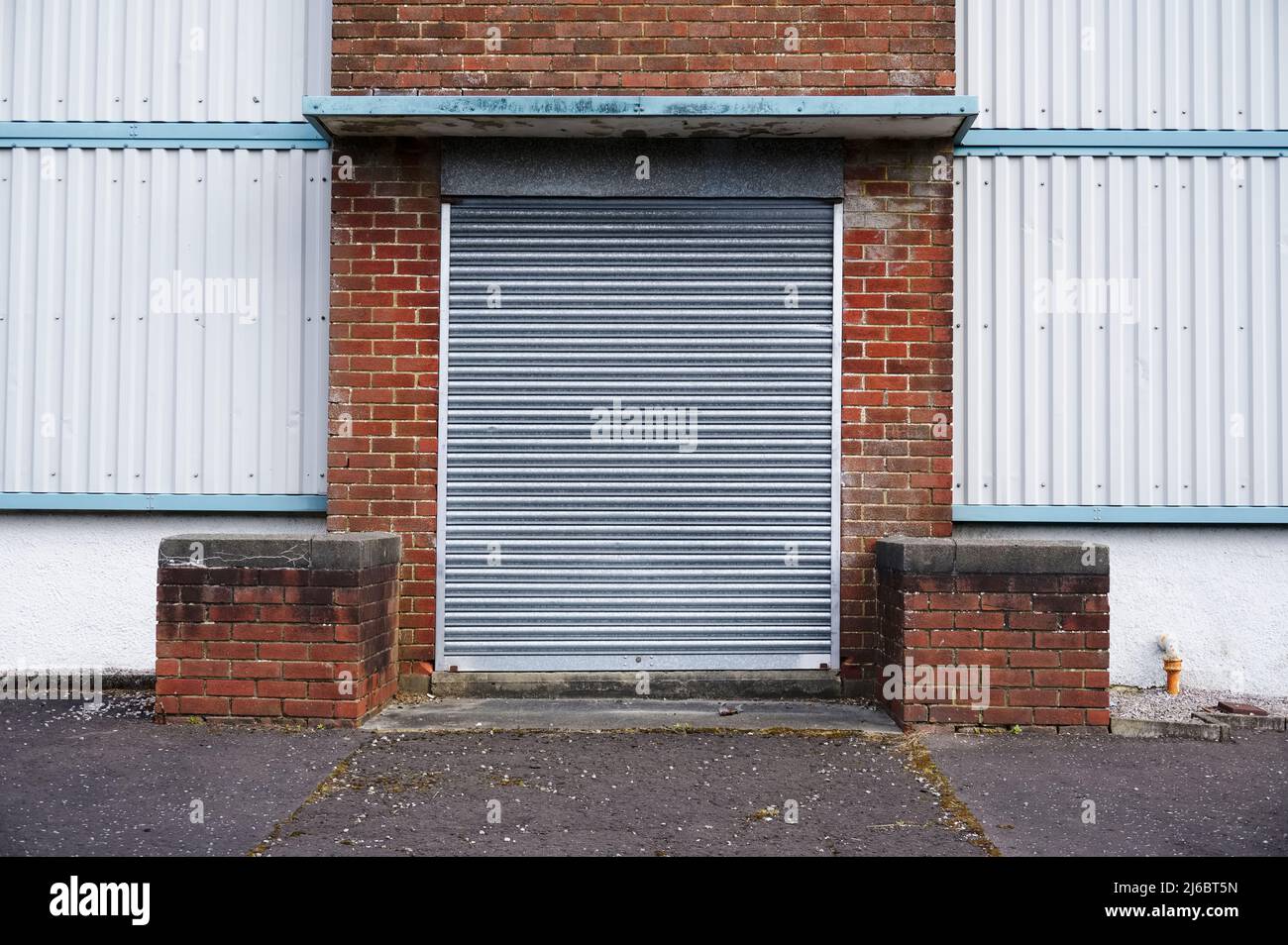 Office window shutters closed due to business closure Stock Photo - Alamy