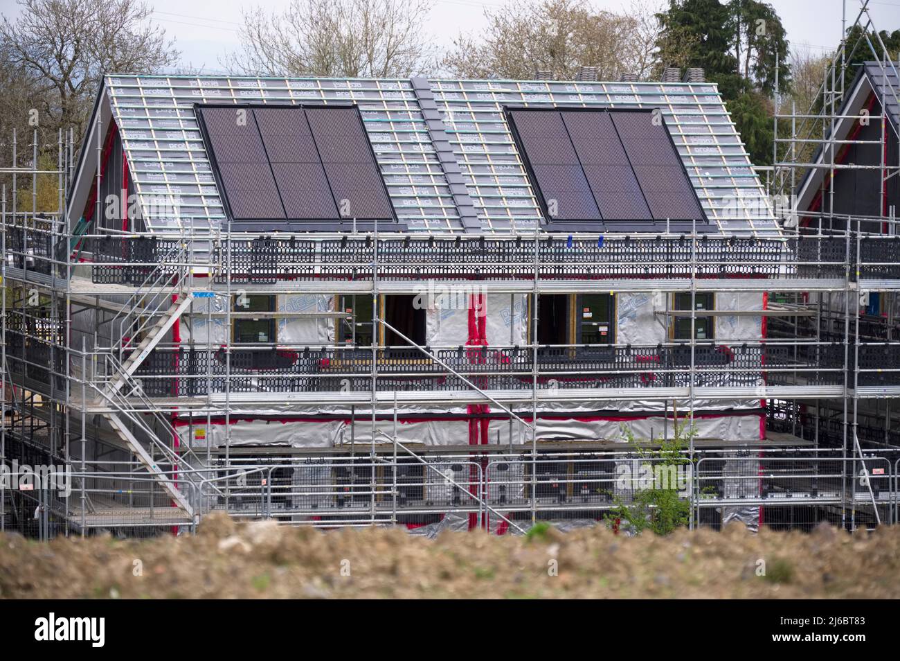 Solar panels installed on new houses being built Stock Photo - Alamy