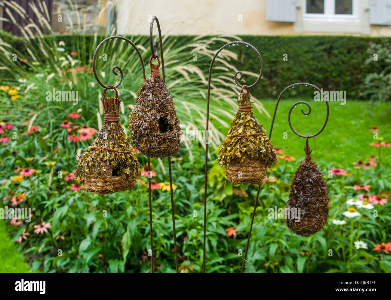Straw birdhouses are suspended Stock Photo - Alamy
