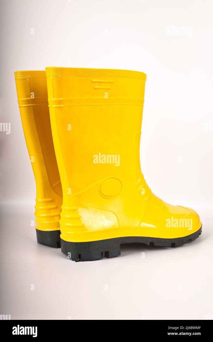 Robust and waterproof yellow rubber boots isolated on white background ...