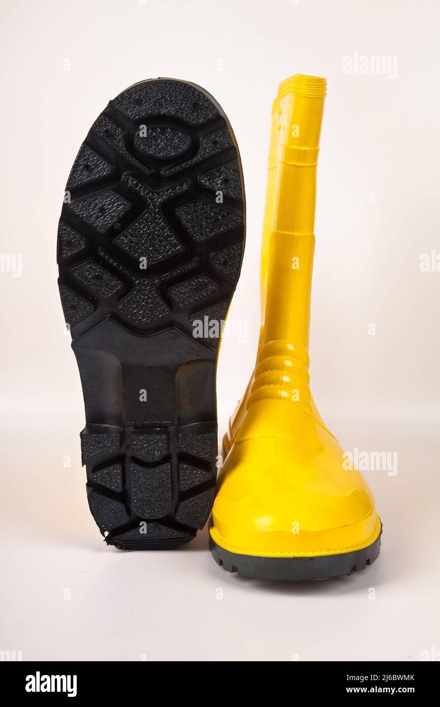 Robust and waterproof yellow rubber boots isolated on white background ...