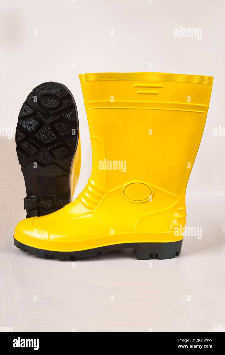 Robust and waterproof yellow rubber boots isolated on white background ...