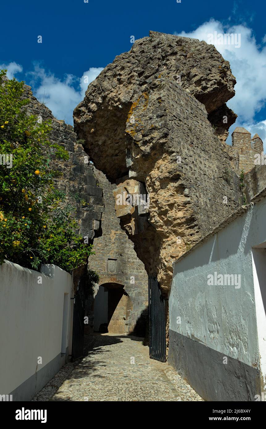 Serpa Castle entrance with the iconic ruins of its keep tower. Alentejo ...