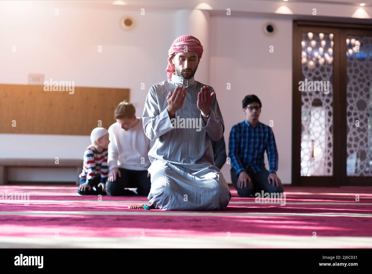 Prayer with a thankful heart. Group of muliethnic religious muslim ...