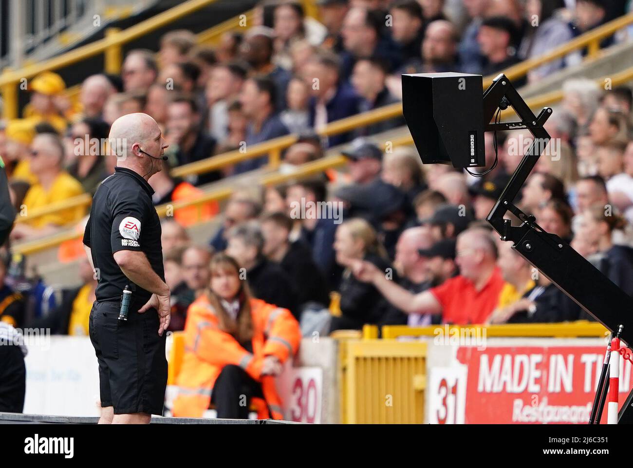 Referee Simon Hooper checks VAR for a handball during the Premier ...