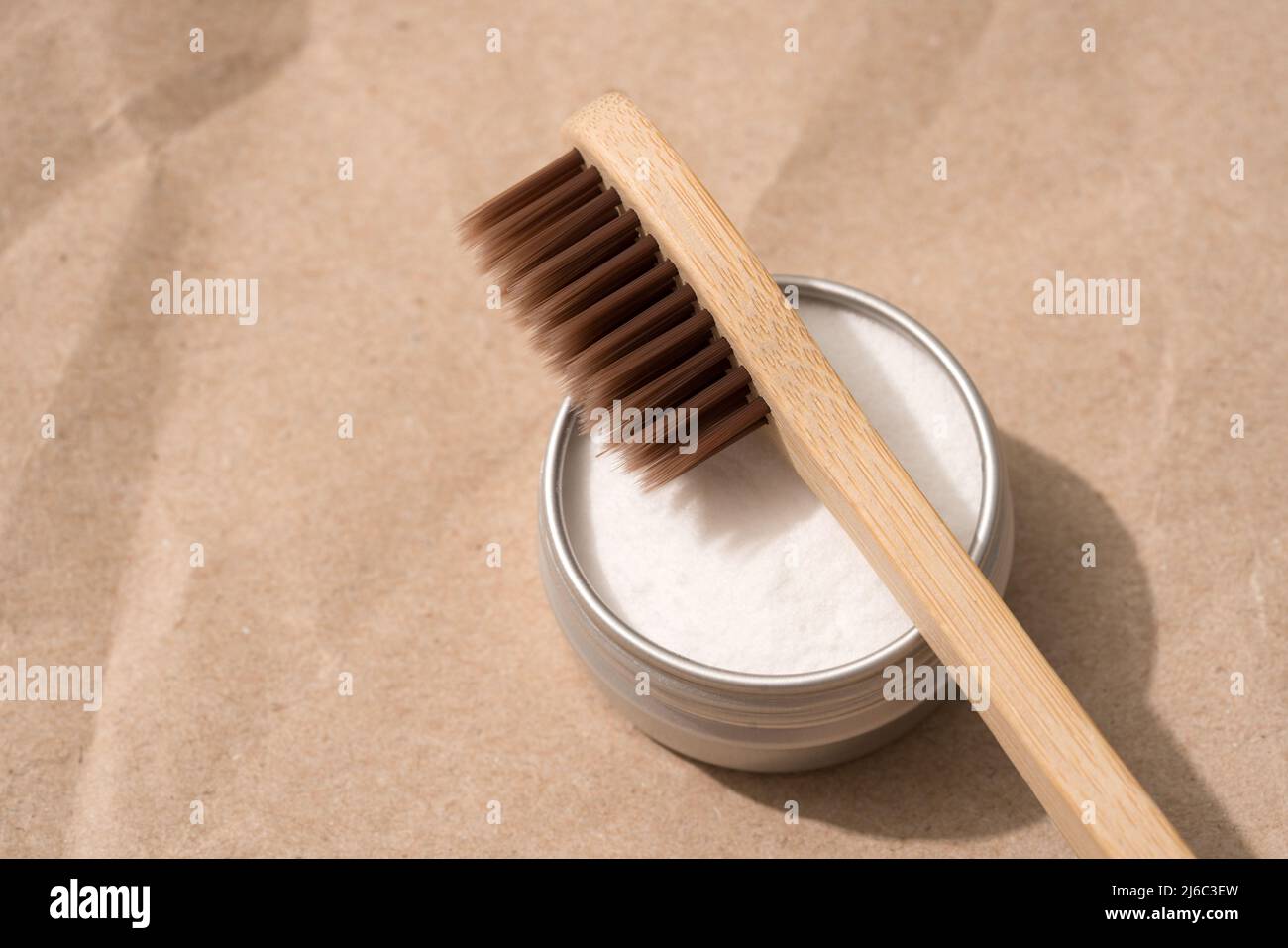 Brown wooden bamboo toothbrushes with mineral toothpowder kaolin in ...