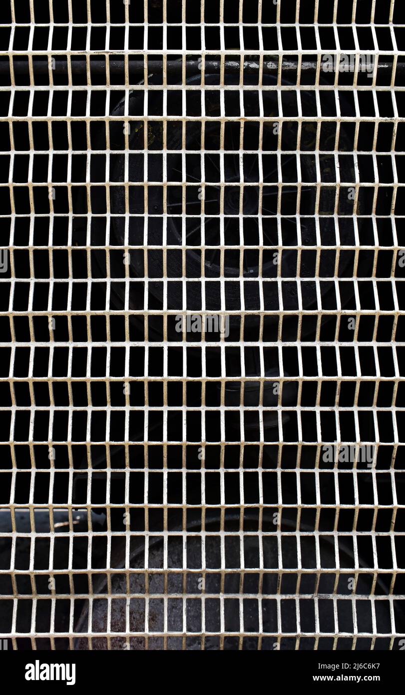 Perforated metallic surface texture background, grid on bus engine ...