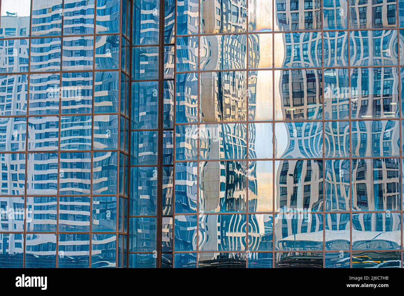 Moscow city glass skyscraper close up view of a blue glass wall with ...