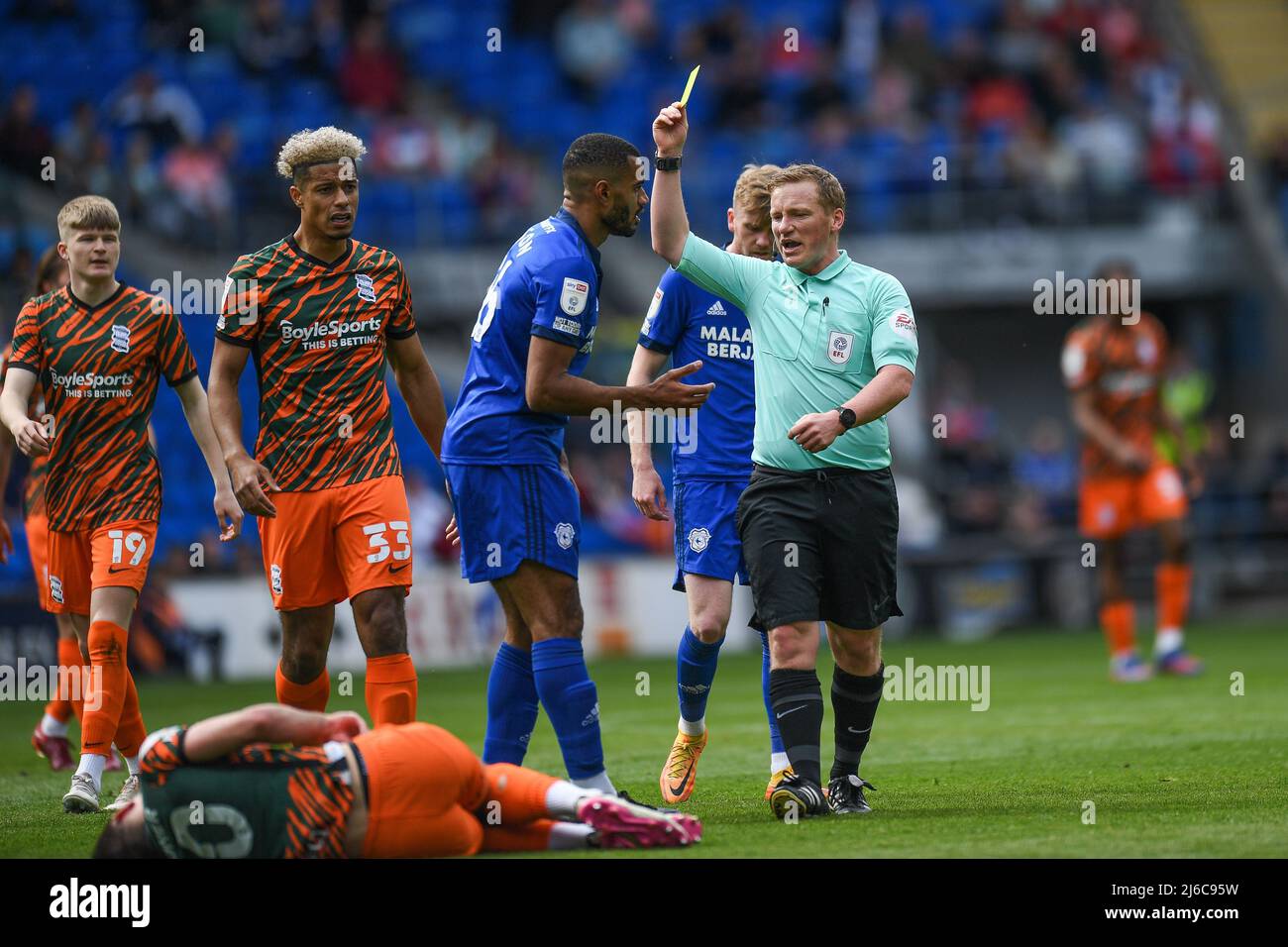 John Busby, referee gives Curtis Nelson #16 of Cardiff City a yellow ...