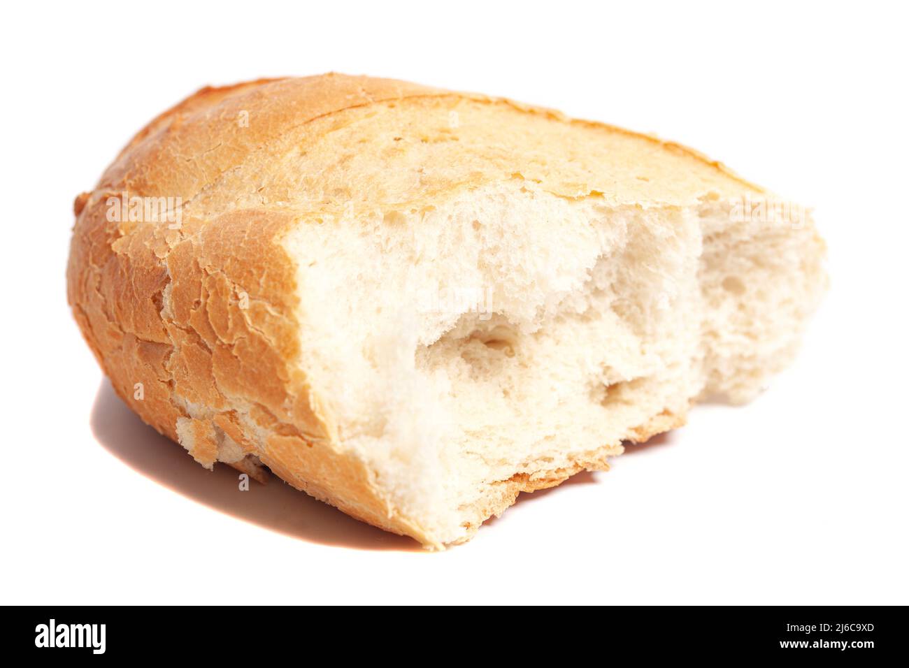 Broken white bread isolated on white Stock Photo - Alamy
