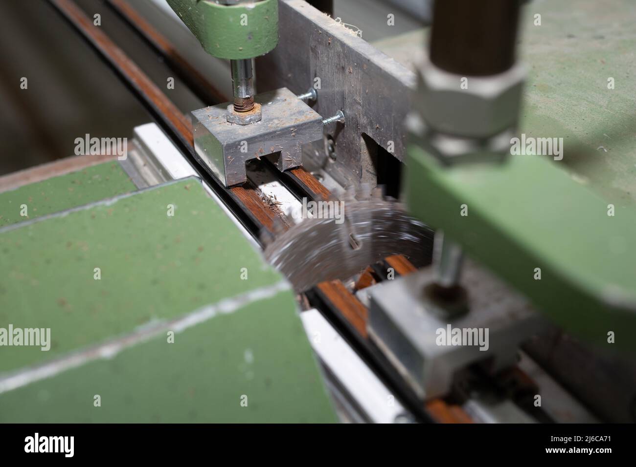 Close up photo of a construction machine for manufacturing of skirting ...