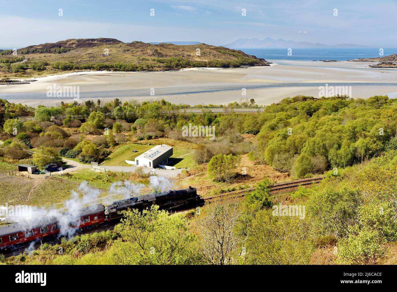 JACOBITE STEAM TRAIN IN MORAR SCOTLAND TREES IN EARLY SPRING THE SILVER ...