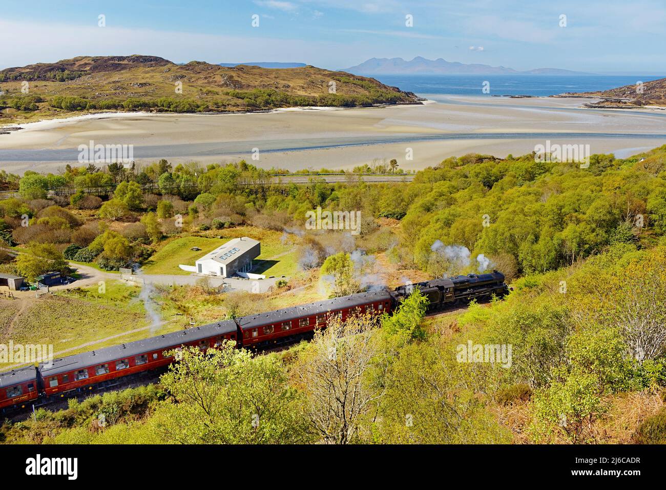JACOBITE STEAM TRAIN NEAR MORAR STATION SCOTLAND TREES IN EARLY SPRING ...