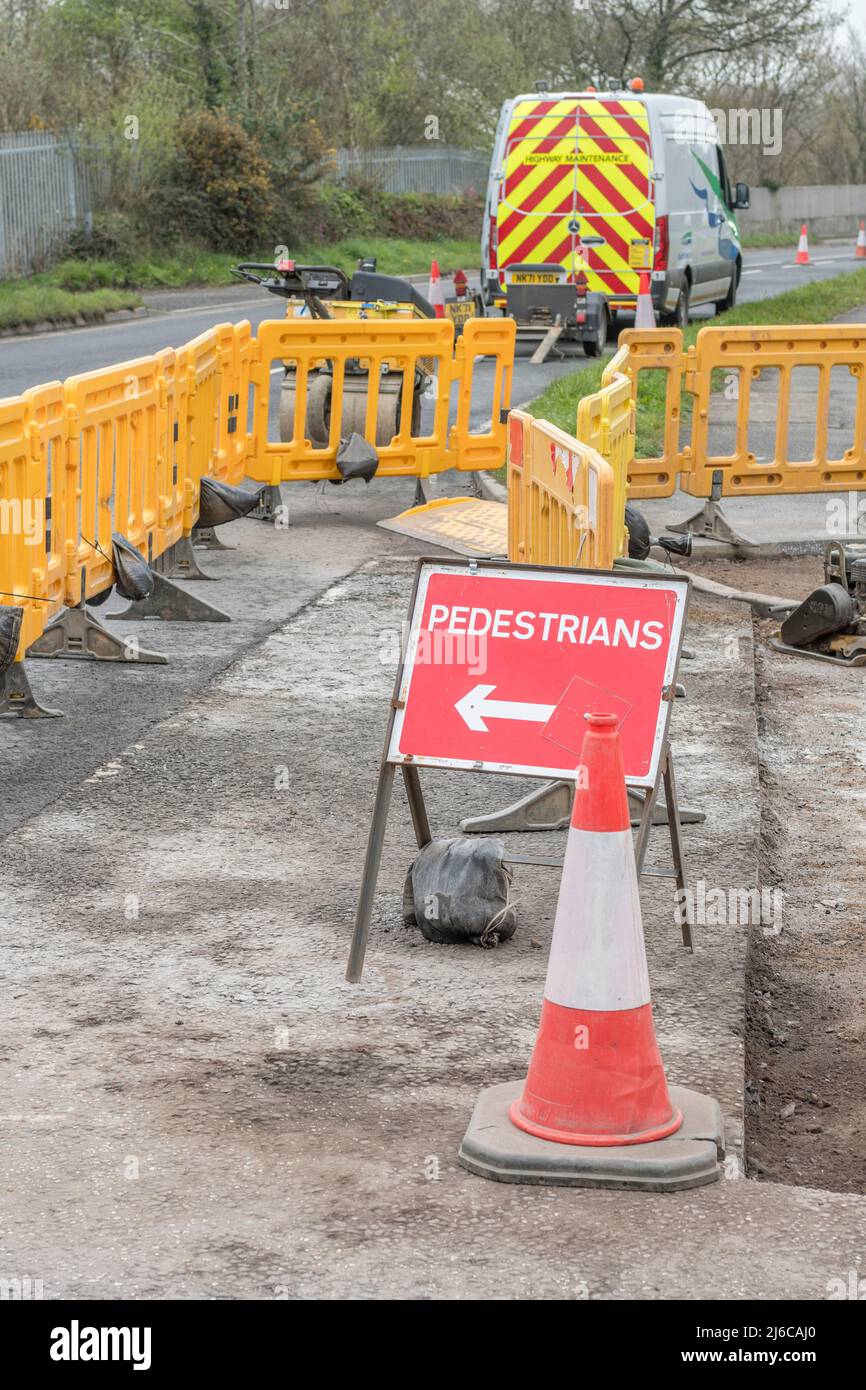 Pedestrians redirection road sign on country road, with yellow safety ...