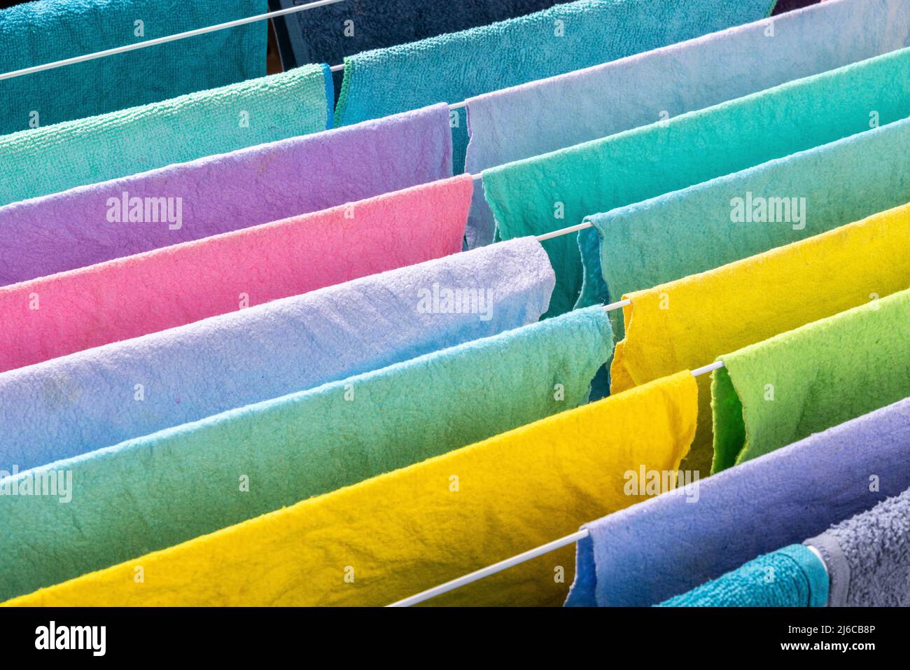Colorful rags hung up for drying Stock Photo - Alamy