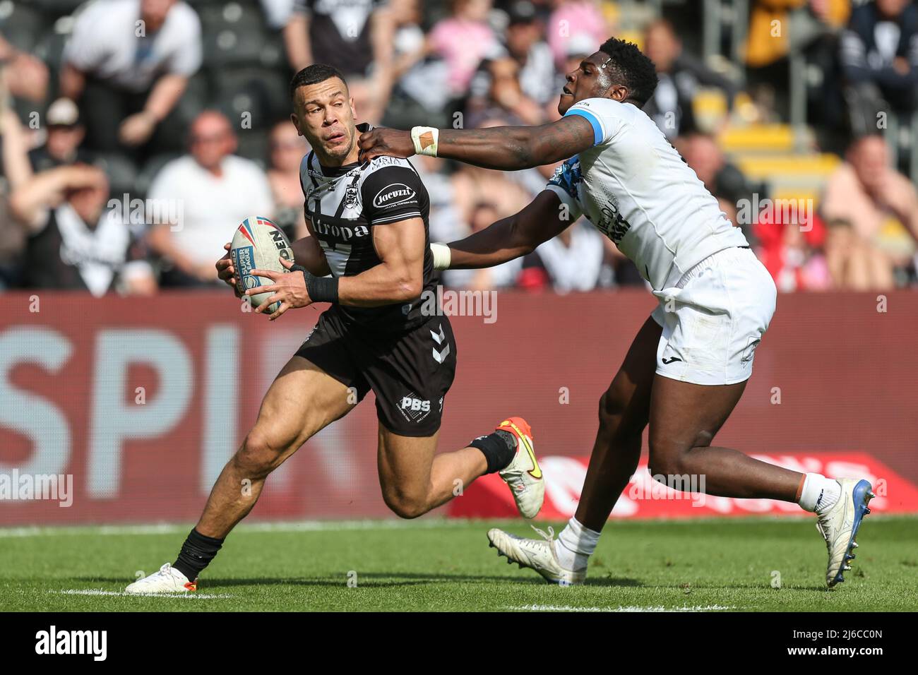 Justin Sangare #23 of Toulouse Olympique gets a hand on Carlos ...