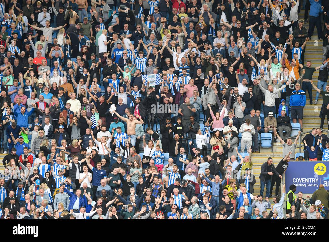 The Huddersfield Town fans celebrate their team scoring a goal to make ...