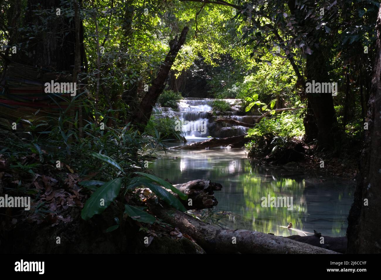 Cascade of waterfalls under tree shade on a mountain river at Erawan ...
