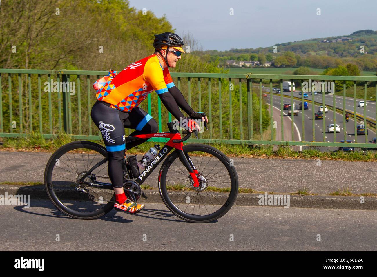 Velo Club Orrel park Pinarello cycle riders, wearing team club colours ...