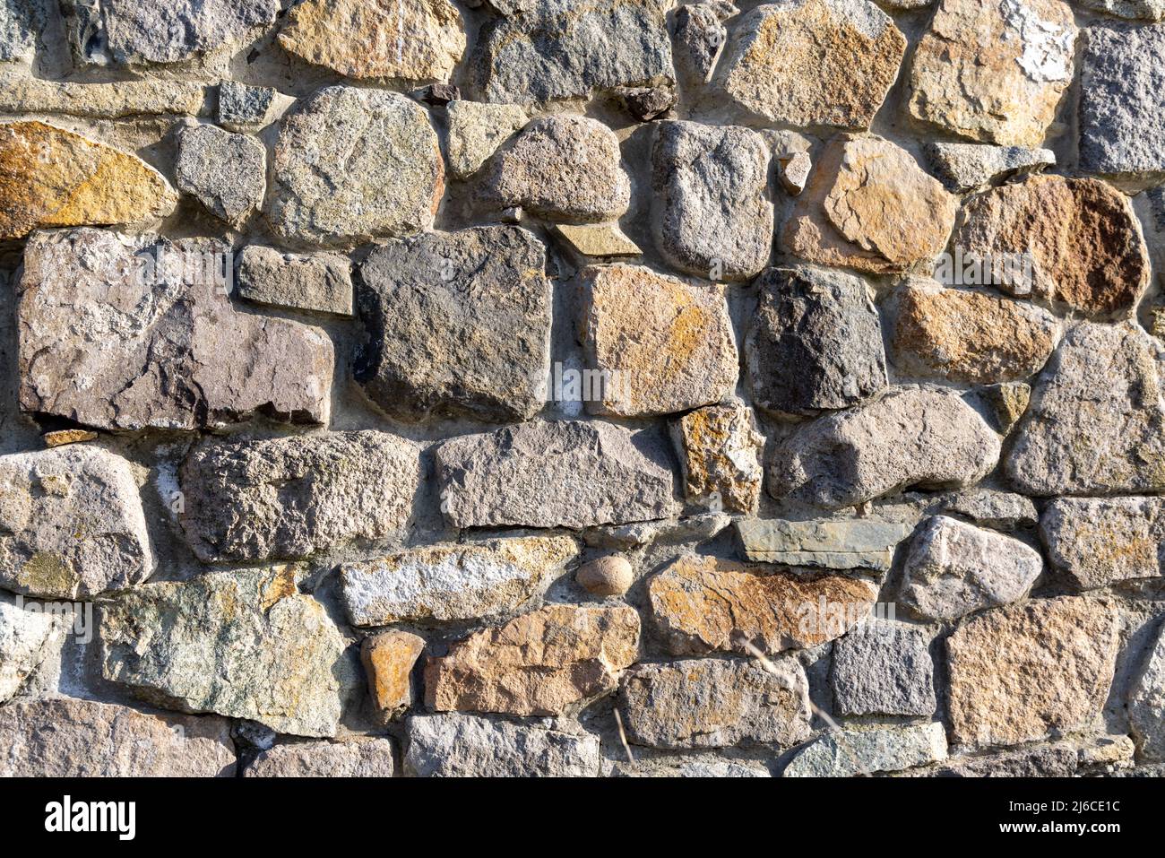 Ancient gray texture background from an ancient strong uneven wall with ...
