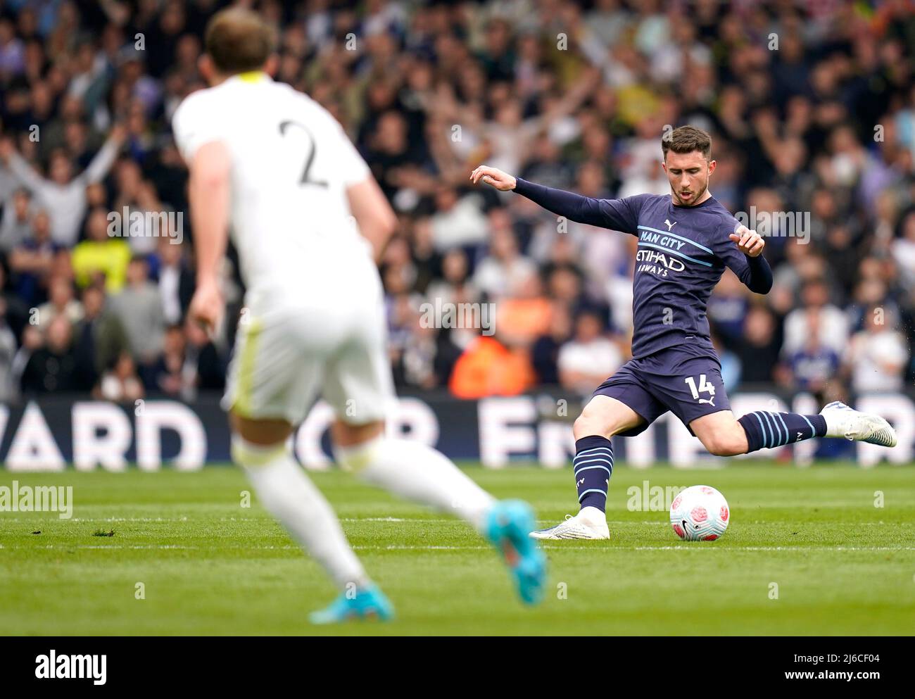 Manchester City's Aymeric Laporte (right) attempts a cross during the ...