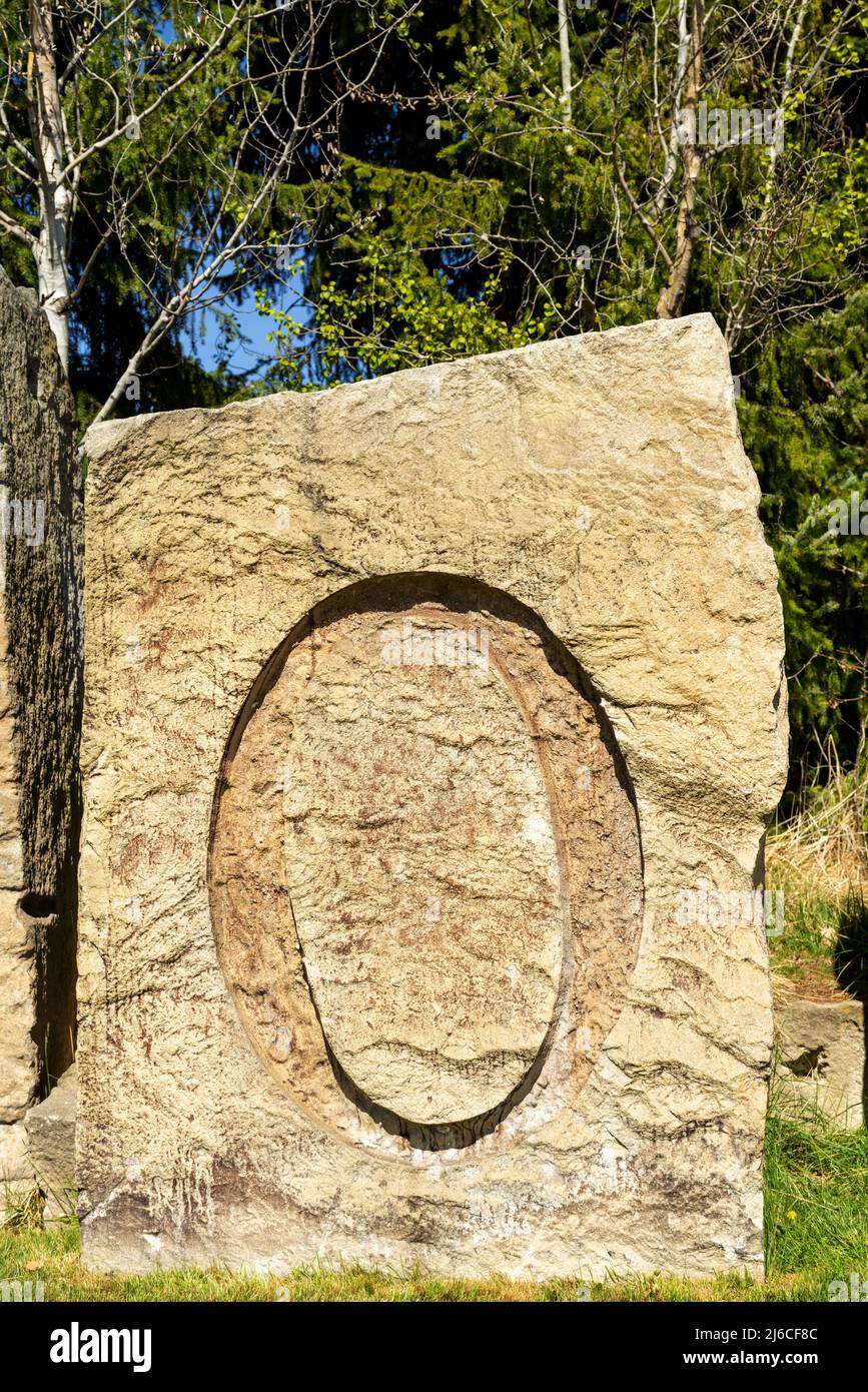 Text letter chiseled in sandstone at a park with trees Stock Photo - Alamy
