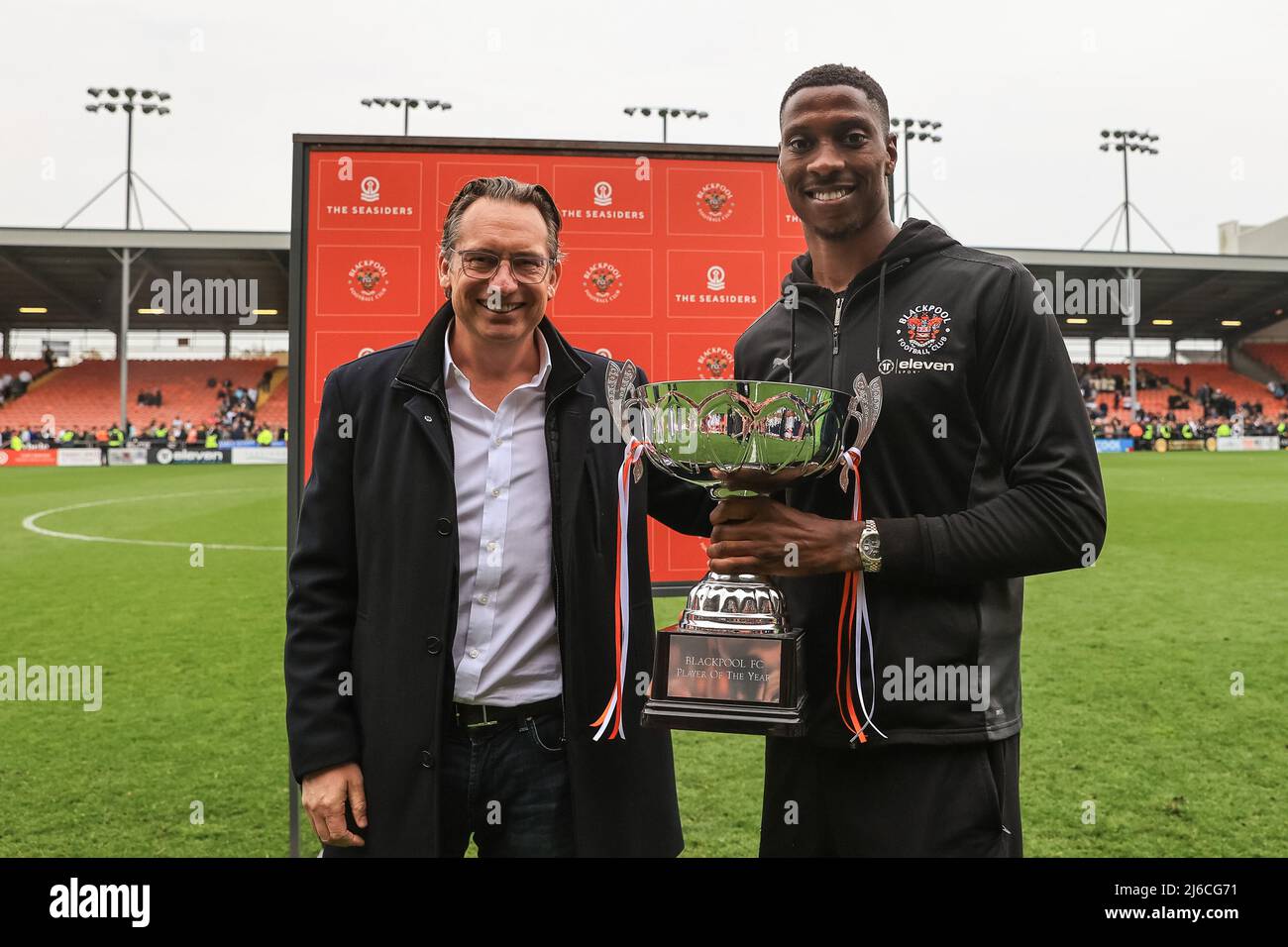 Simon Sadler owner of Blackpool presents the player of the year trophy ...