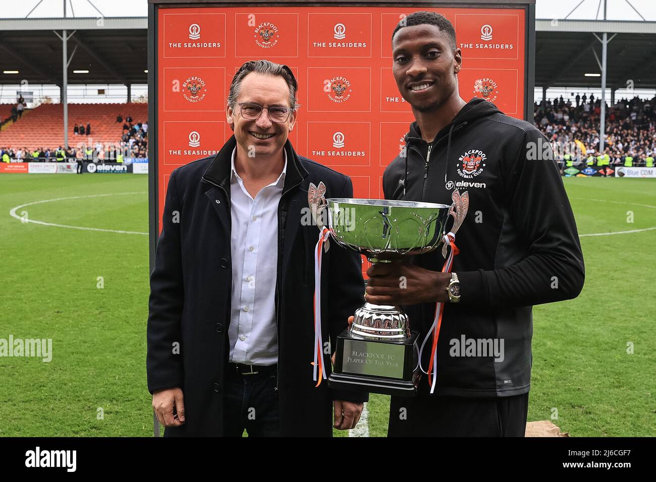 Simon Sadler owner of Blackpool presents the player of the year trophy ...