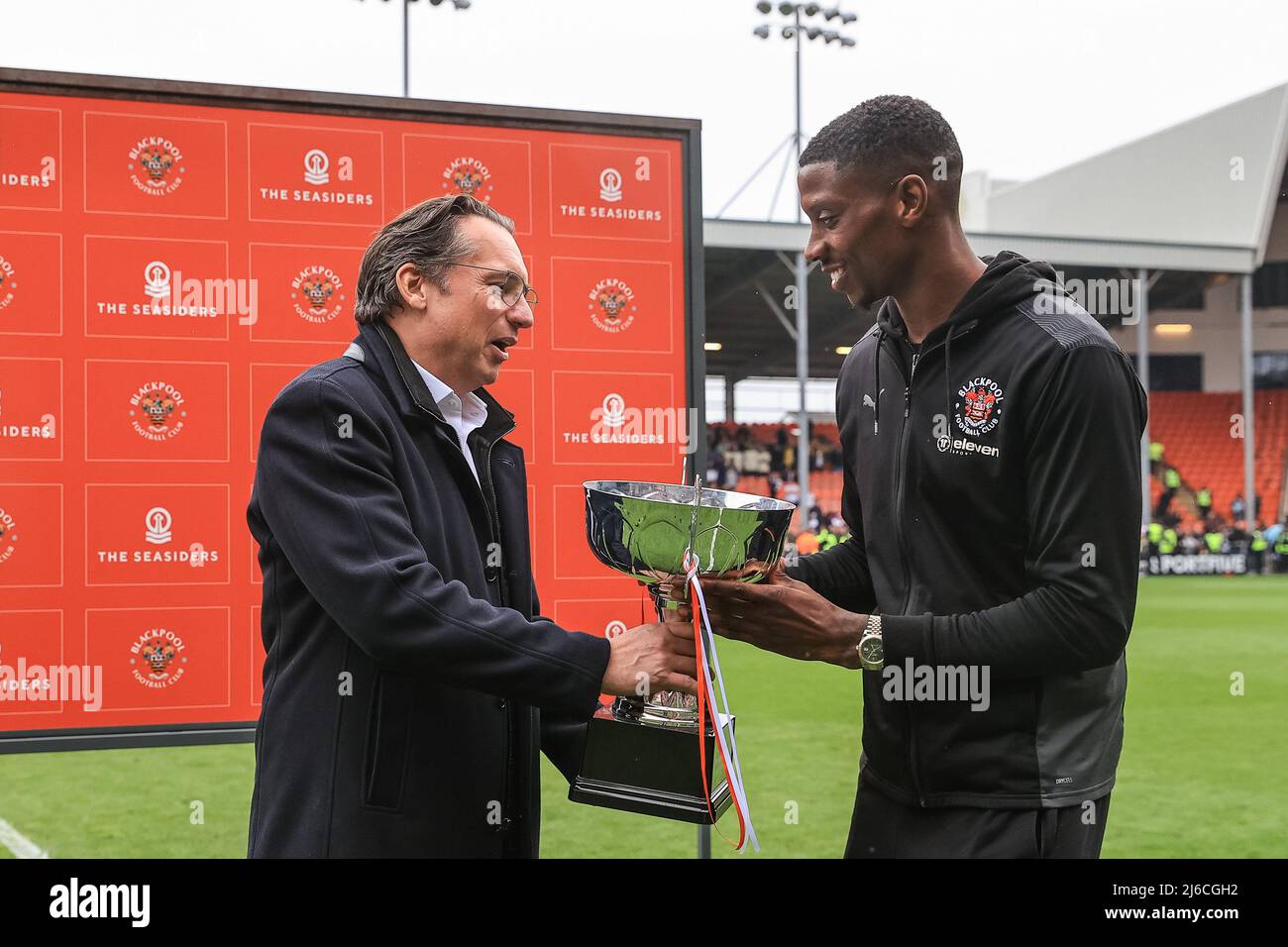 Simon Sadler owner of Blackpool presents the player of the year trophy ...