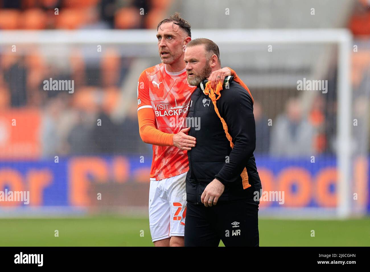 Richard Keogh #26 of Blackpool has words with Wayne Rooney the Derby ...