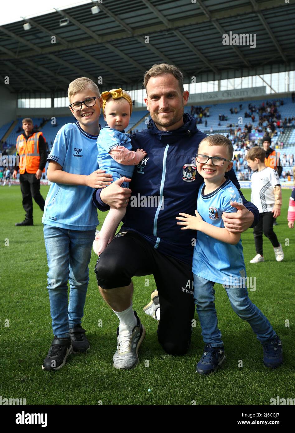 Coventry City goalkeeping coach Aled Williams and his children on a lap ...