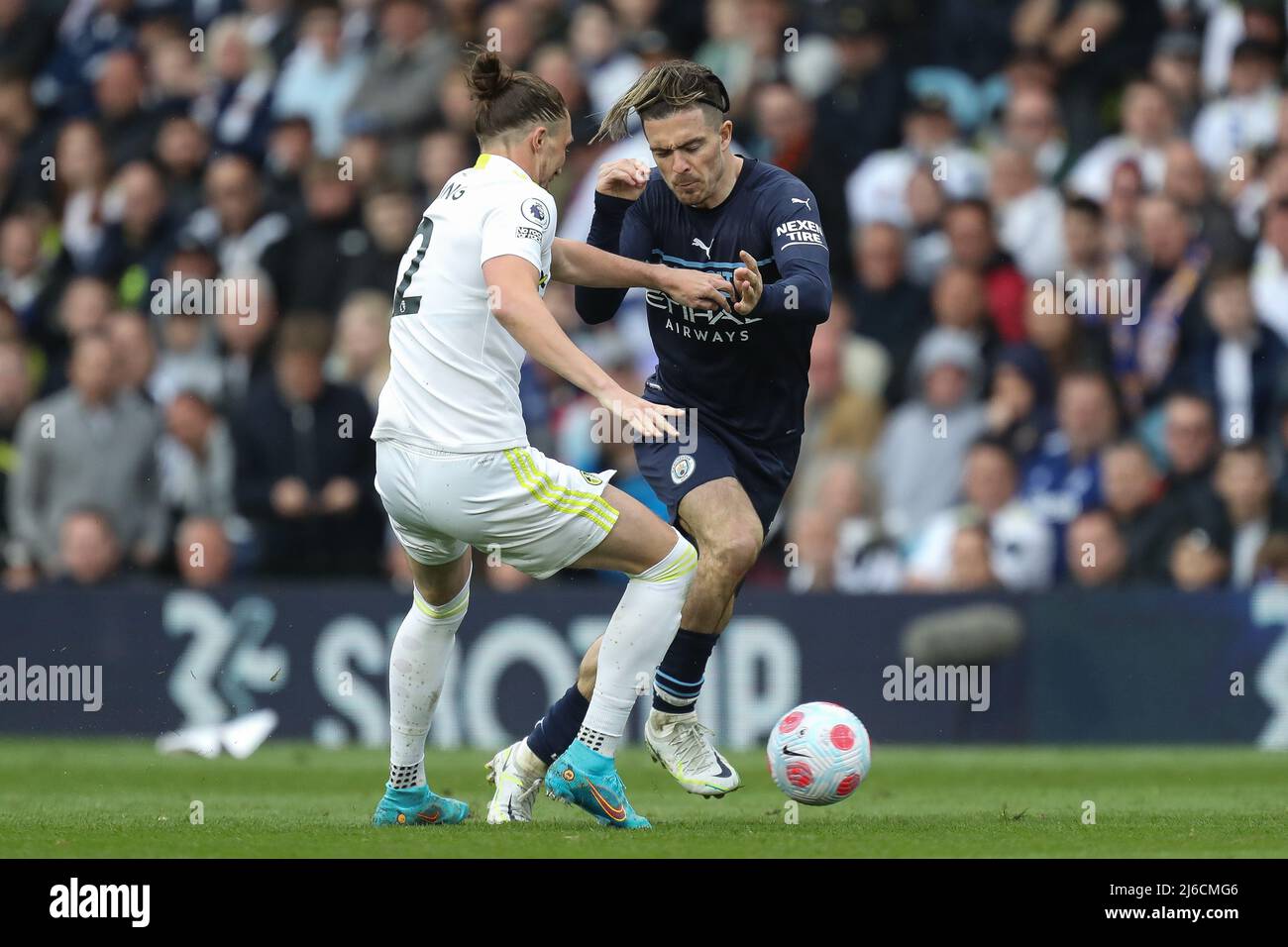 Jack Grealish #10 of Manchester City gets away from Luke Ayling #2 of ...