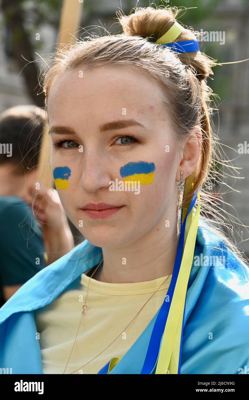 London, UK. An activist wears. face paint in Ukrainian colours. Stand ...