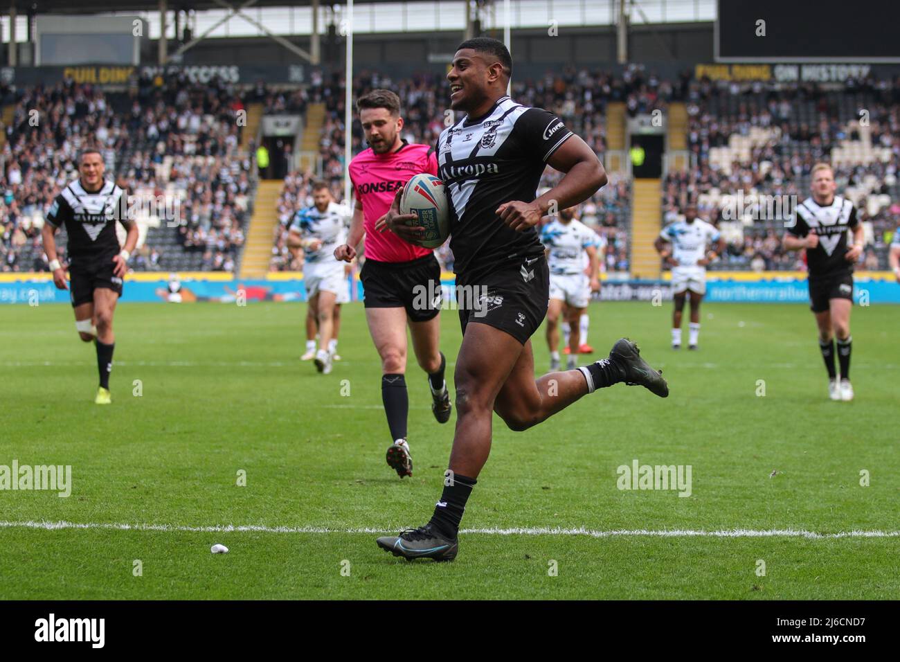 Joe Lovodua #14 of Hull FC runs over the try line to wait to pass to ...