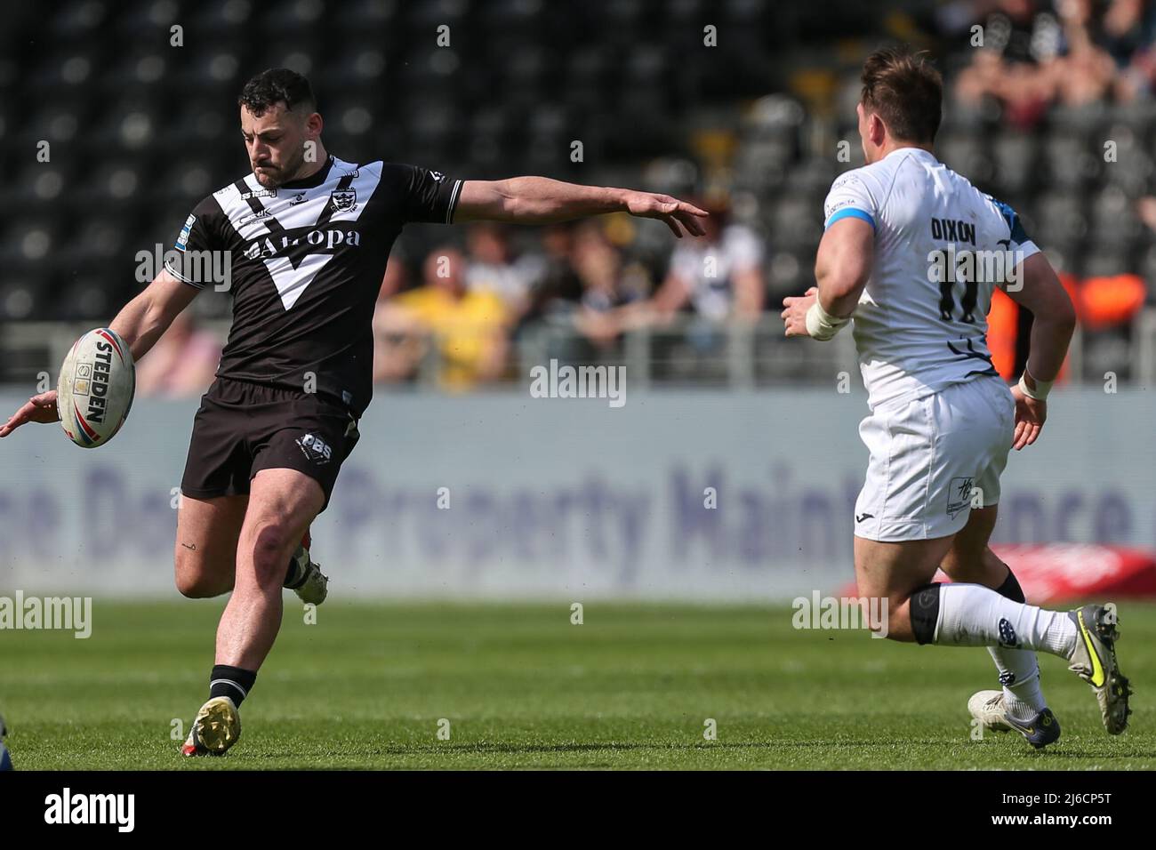 Jake Connor #1 of Hull FC puts a high kick up Stock Photo - Alamy