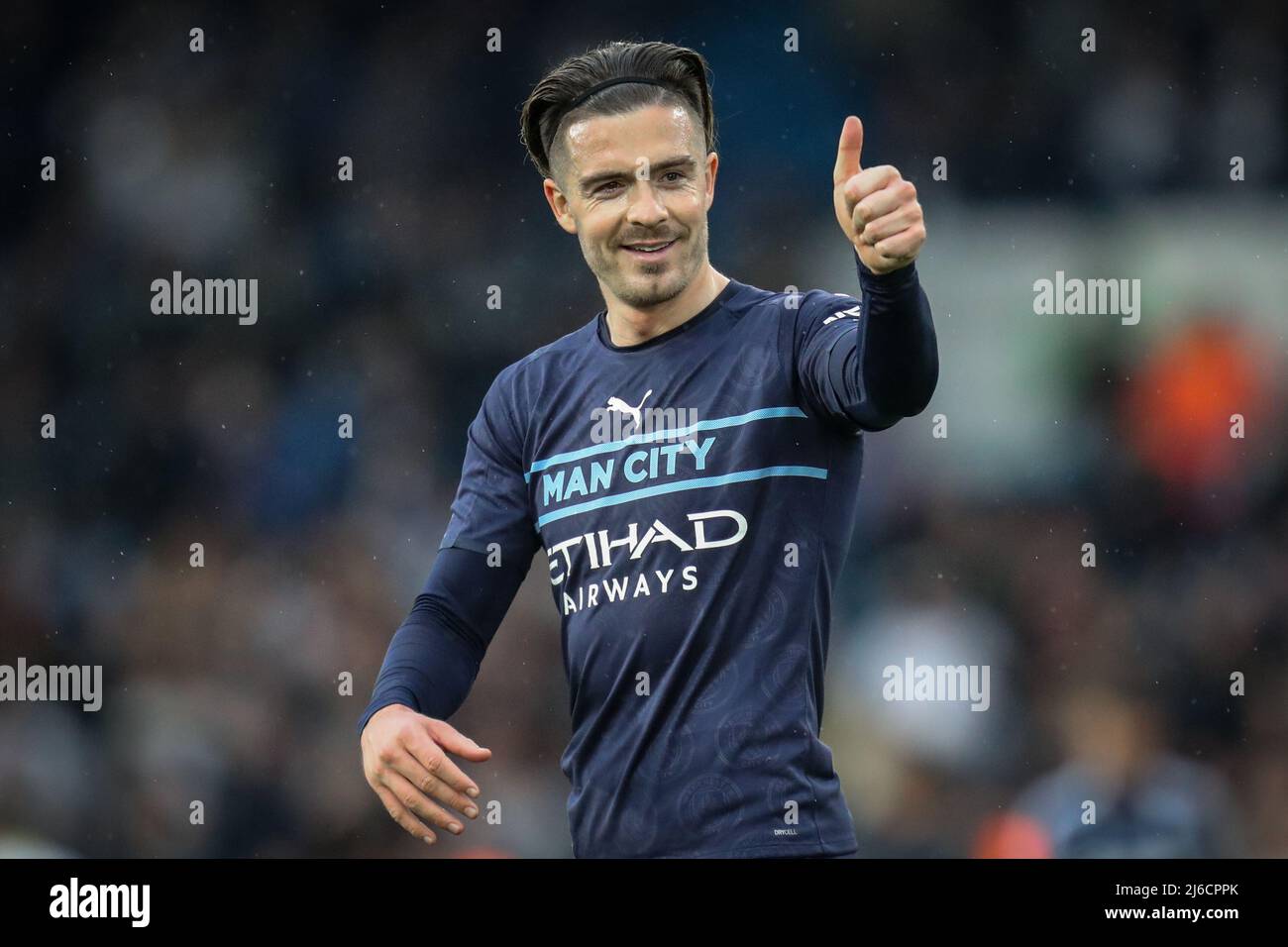 Jack Grealish #10 of Manchester City gives a thumbs up to the Leeds ...