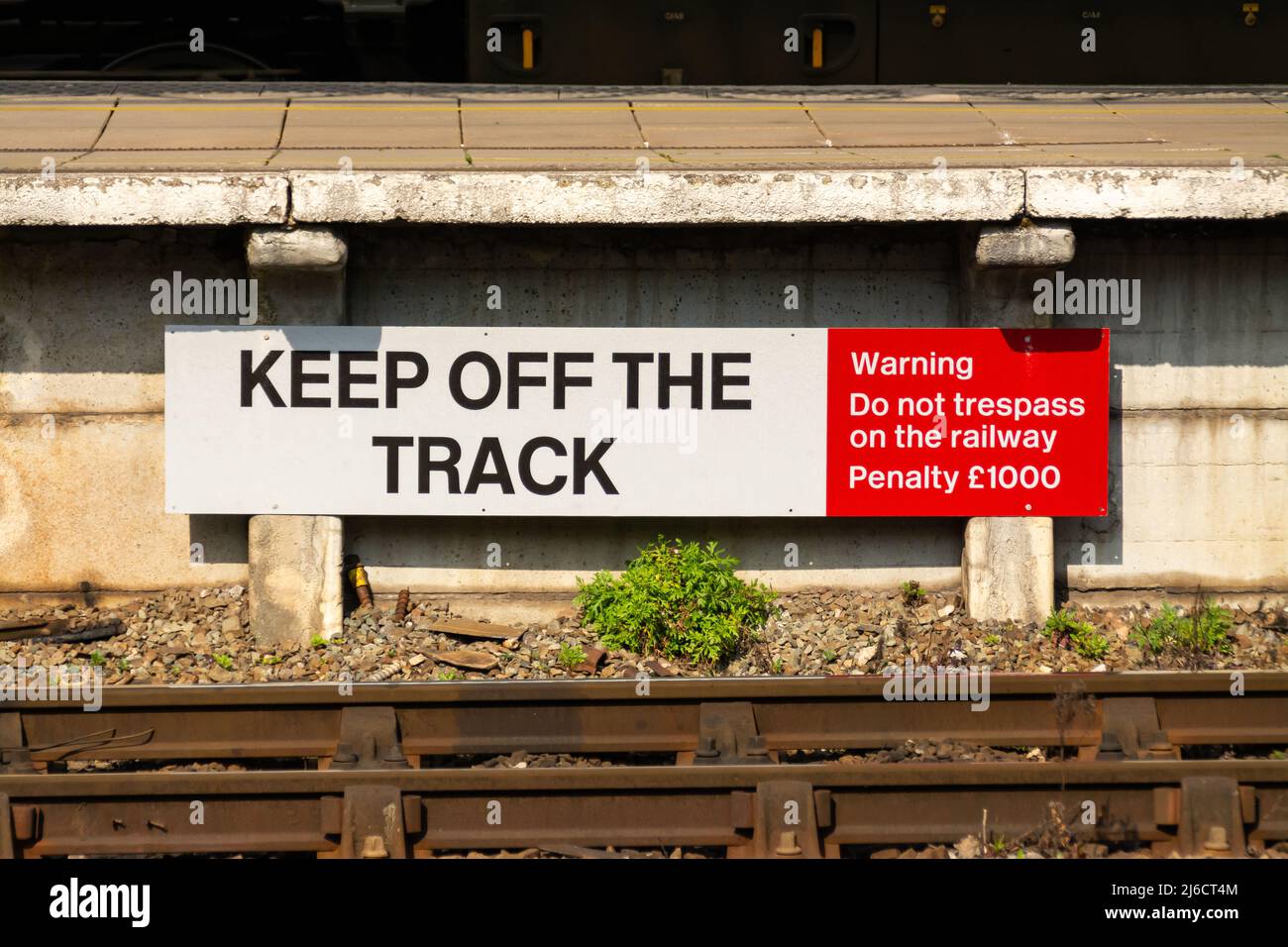 Keep off the track sign next to train track. Manchester, England Stock ...
