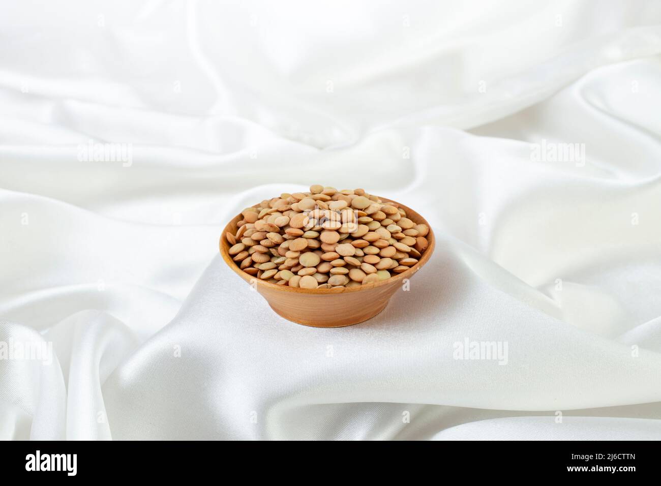 Lens culinaris seeds, lentil or lentils on a wooden bowl Stock Photo ...