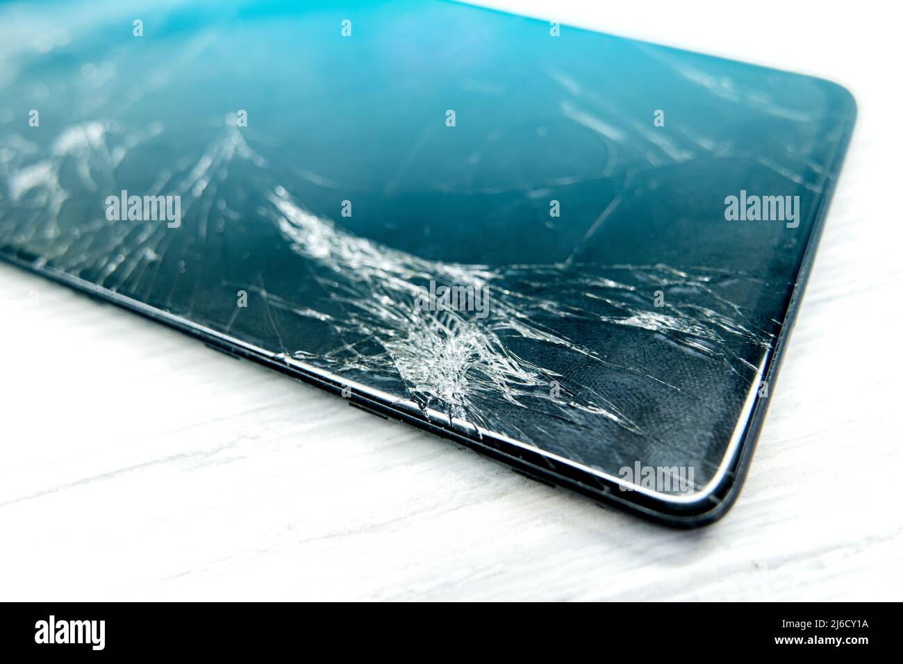 a broken mobile phone screen in the master's hand Stock Photo - Alamy