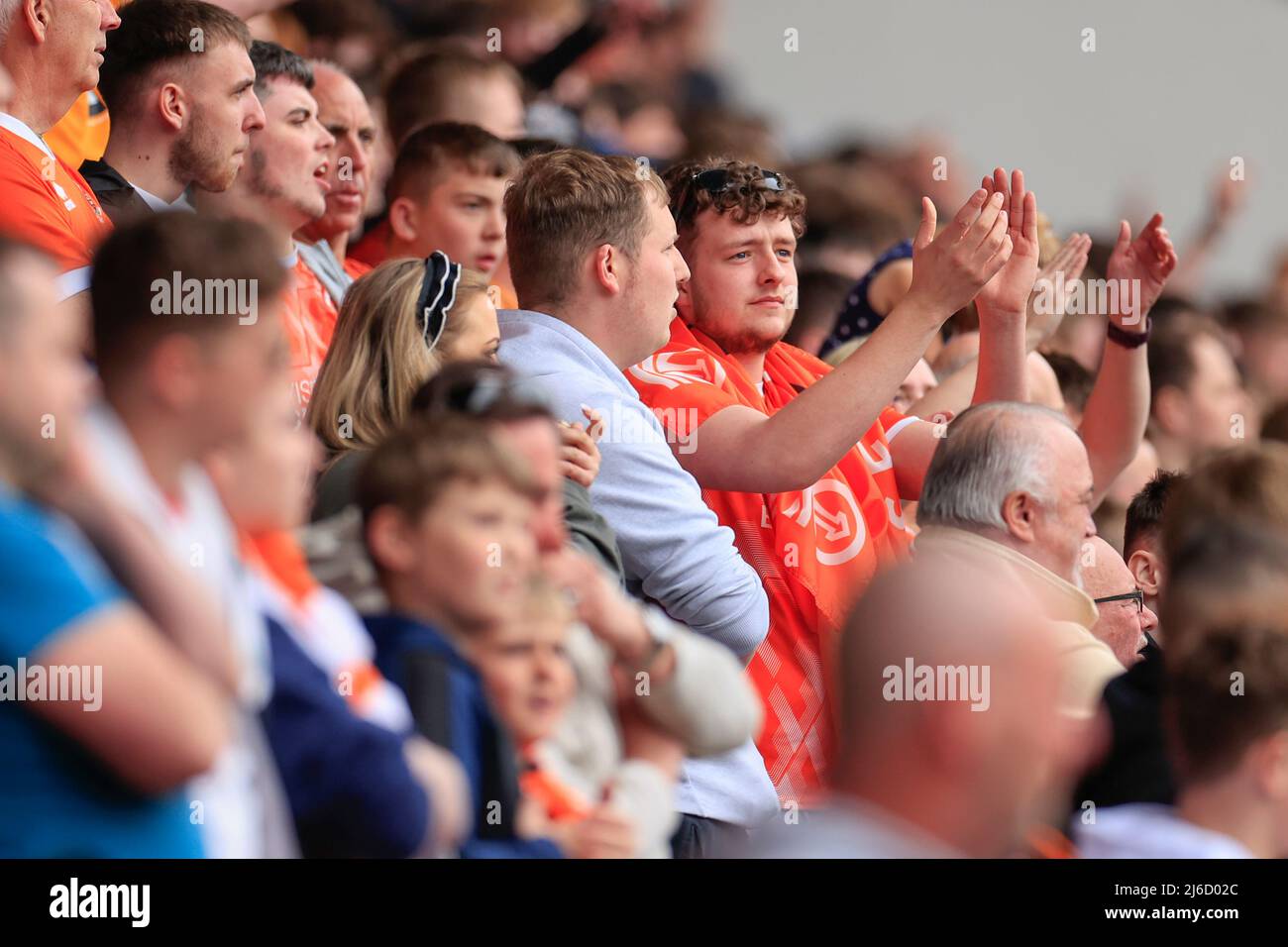 Blackpool fans cheer on their team during the game Stock Photo - Alamy