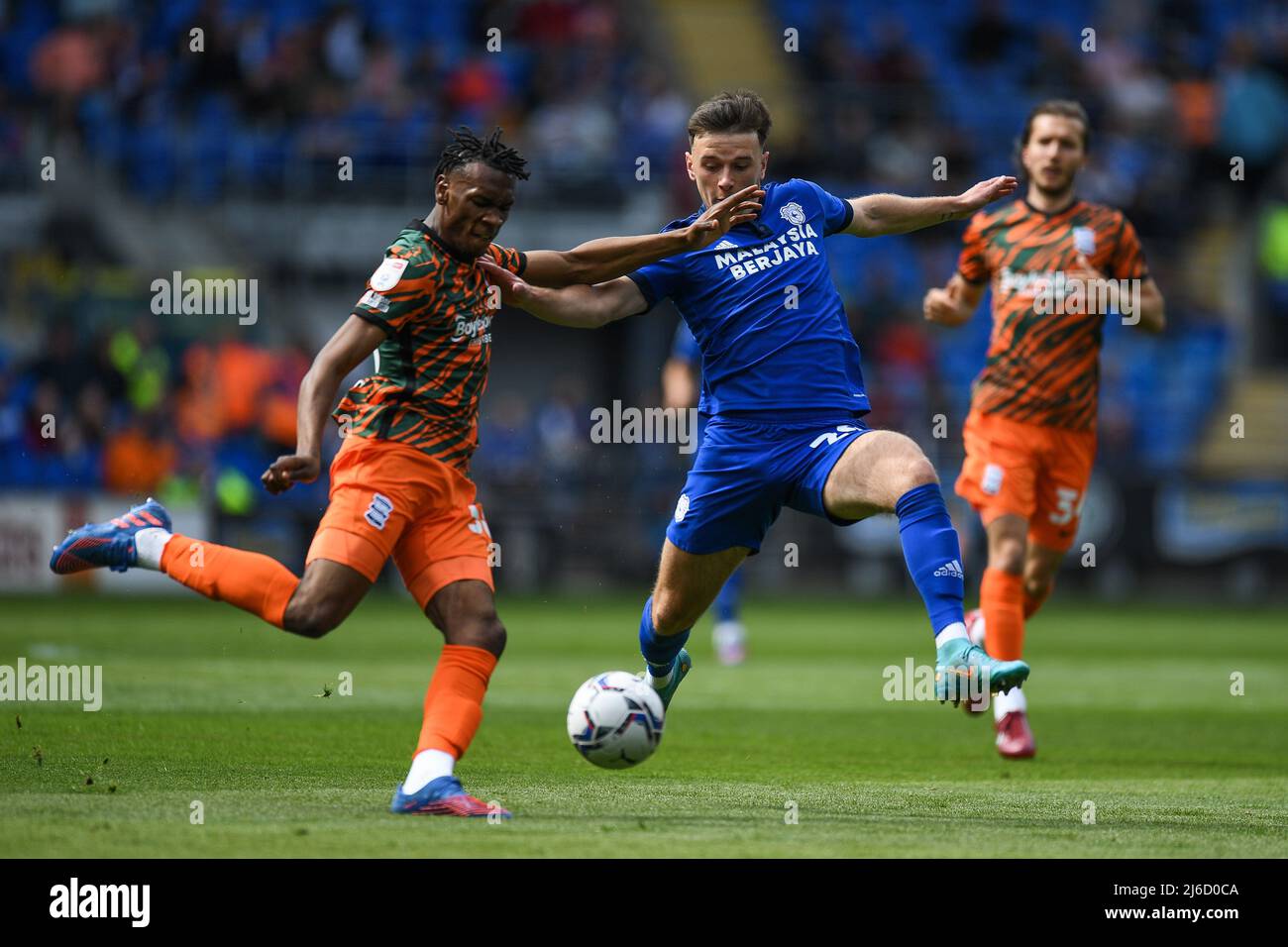 Nico Gordon #50 of Birmingham City clears the ball under pressure from ...