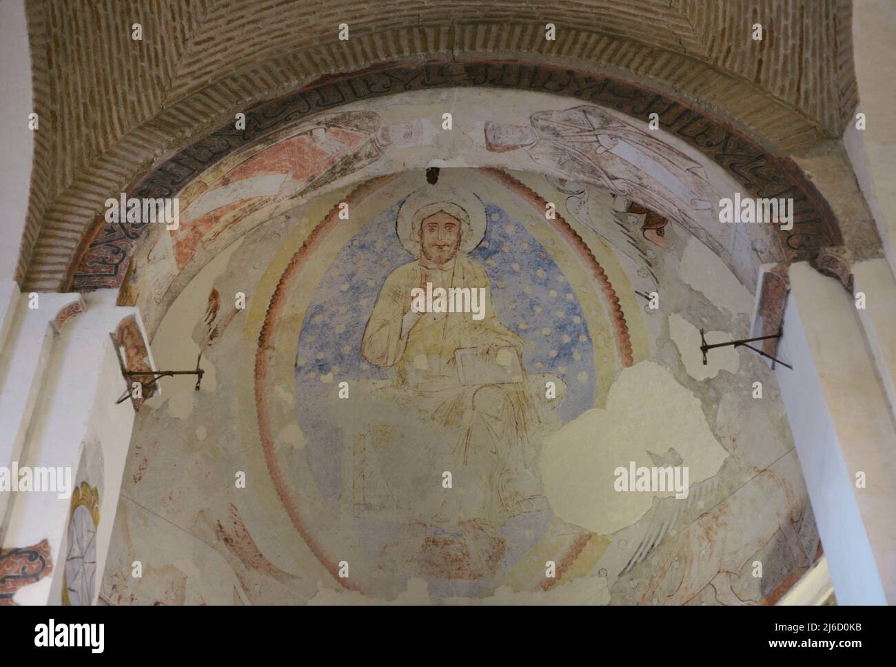 Romanesque fresco depicting Christ in Majesty (Pantocrator) seated on a ...